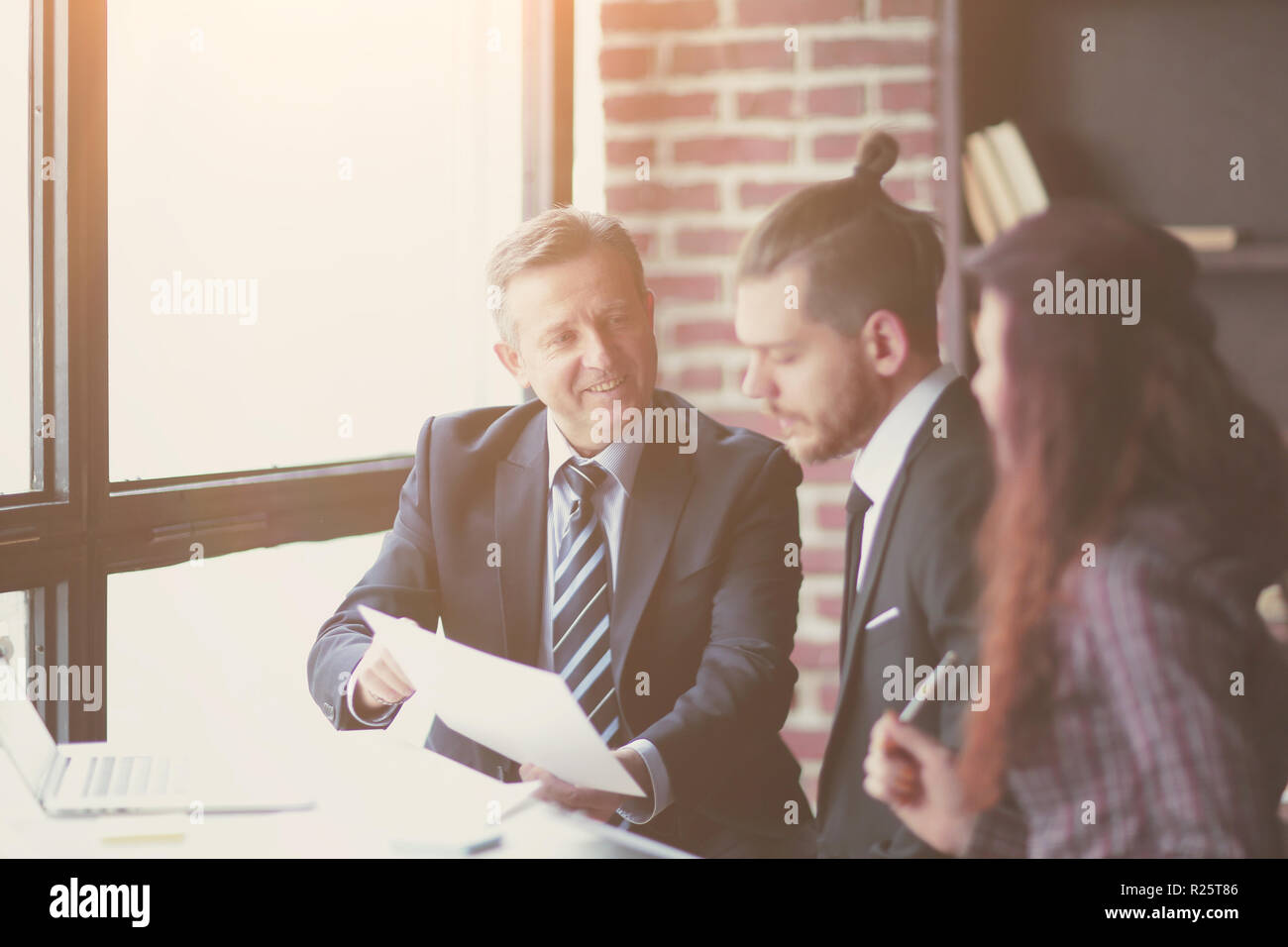 Team business executives discussing desk hi-res stock photography and ...