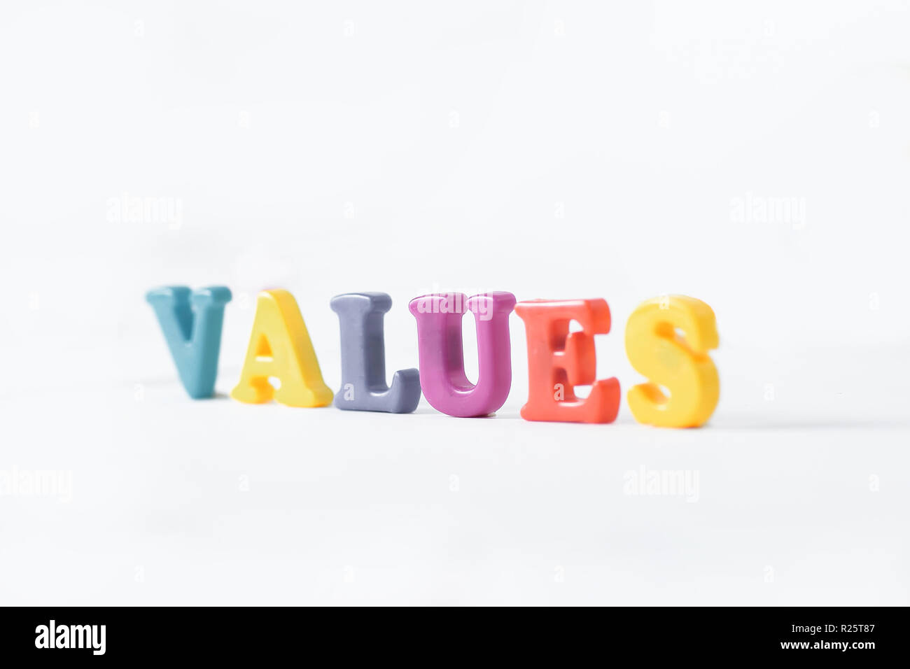 word values on blurred background of school supplies .photo with Stock ...