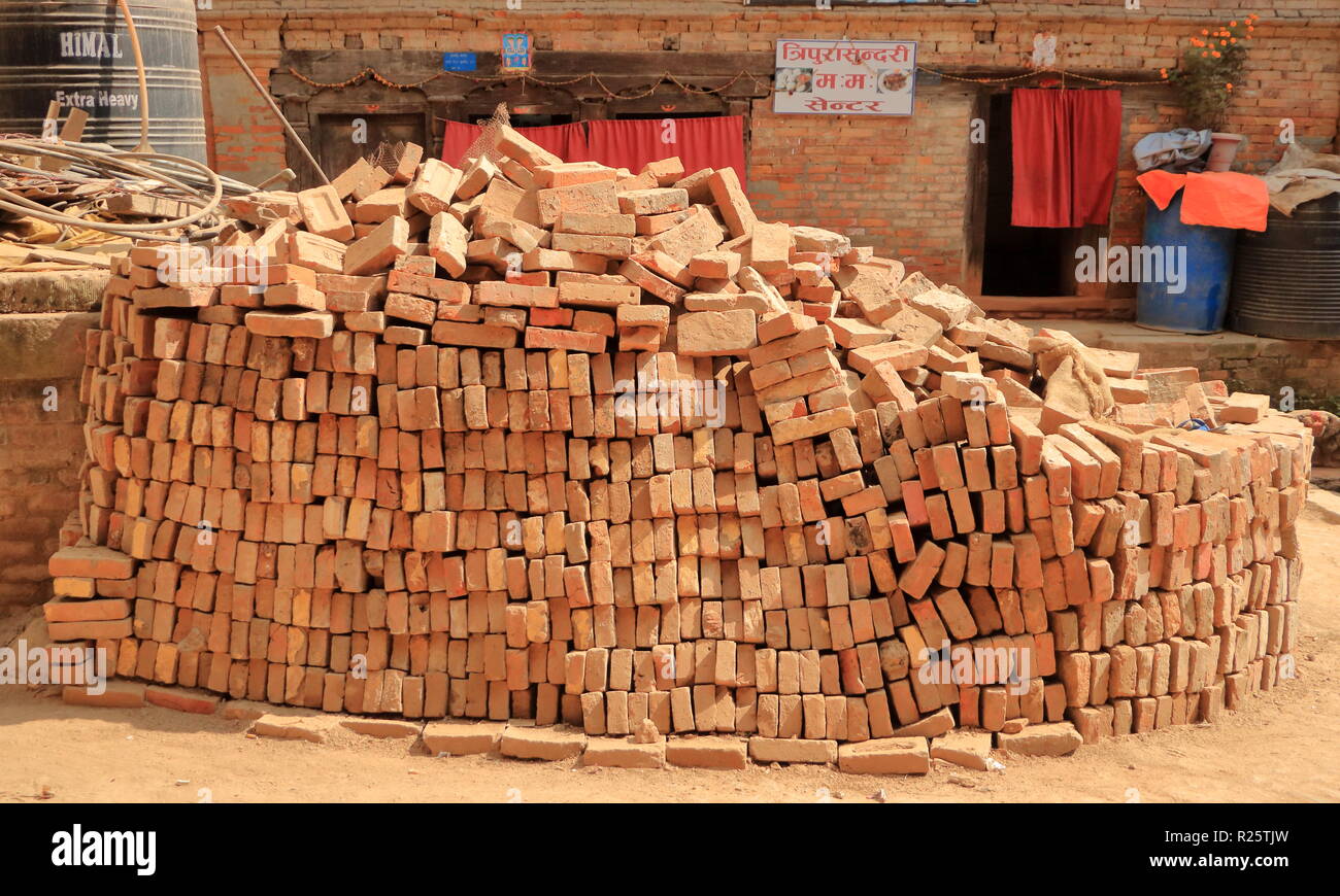 A stack of red clay bricks in Kathmandu in Nepal Stock Photo - Alamy