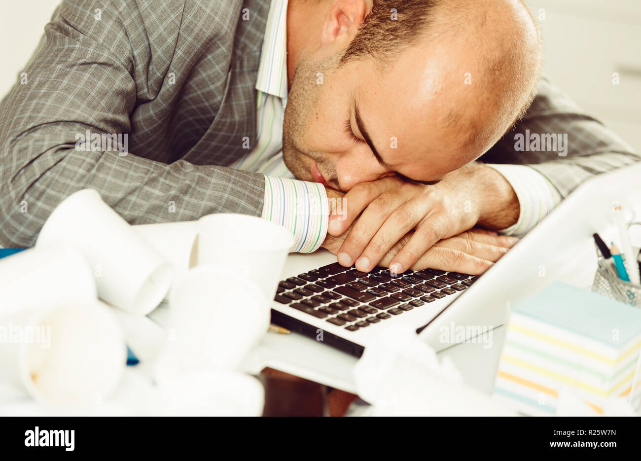 Young sad man tired of working and sleeping in the modern office Stock ...