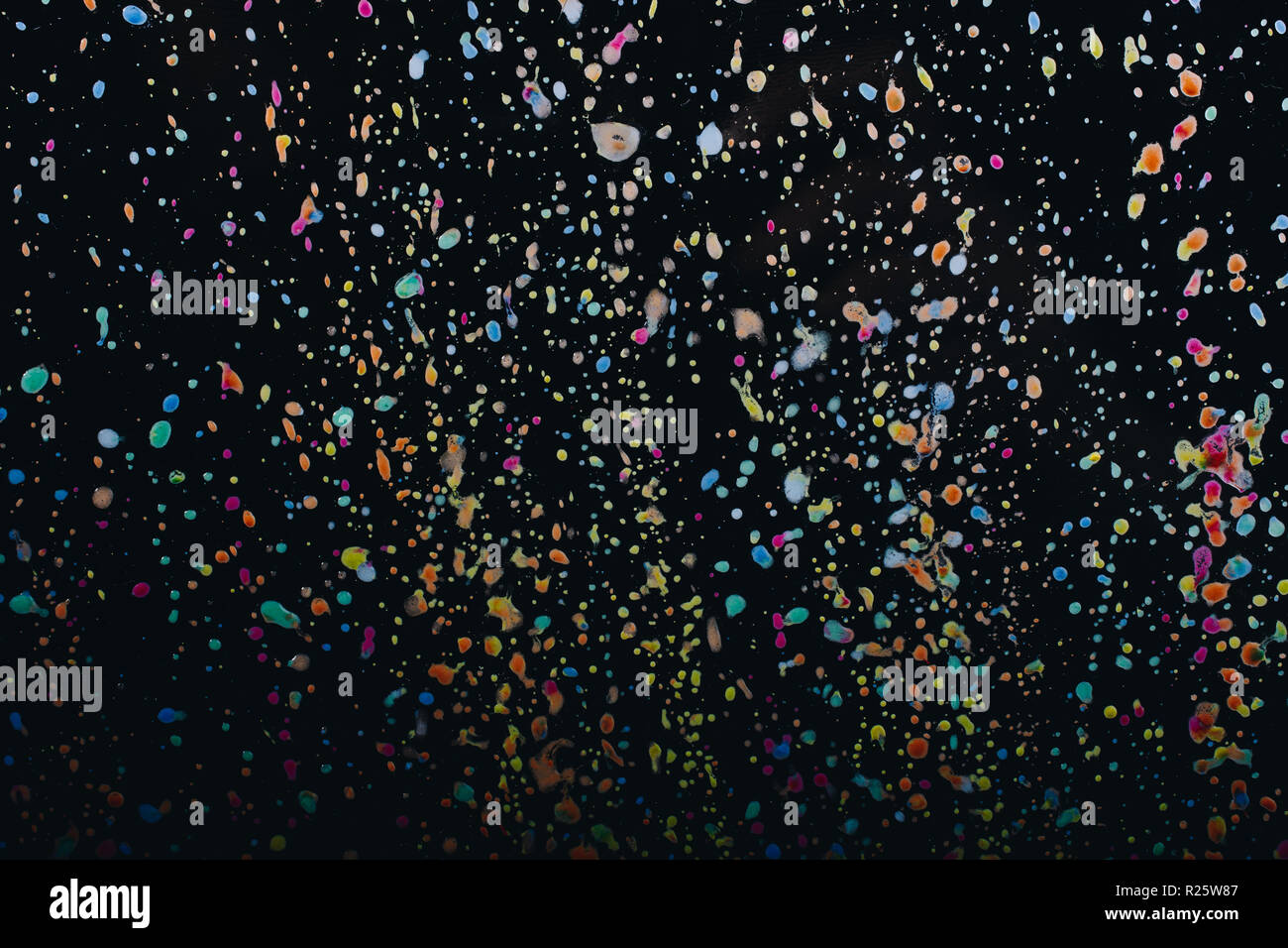 Paint splash effect on a glass on a black background Stock Photo - Alamy