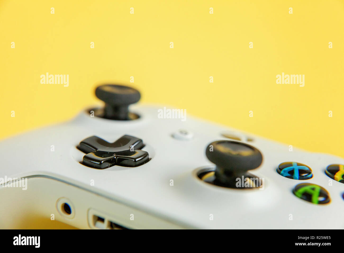 White joystick gamepad, game console on yellow colourful trendy modern ...