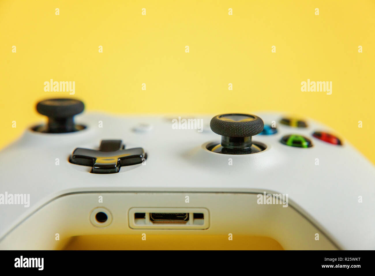 White joystick gamepad, game console on yellow colourful trendy modern ...