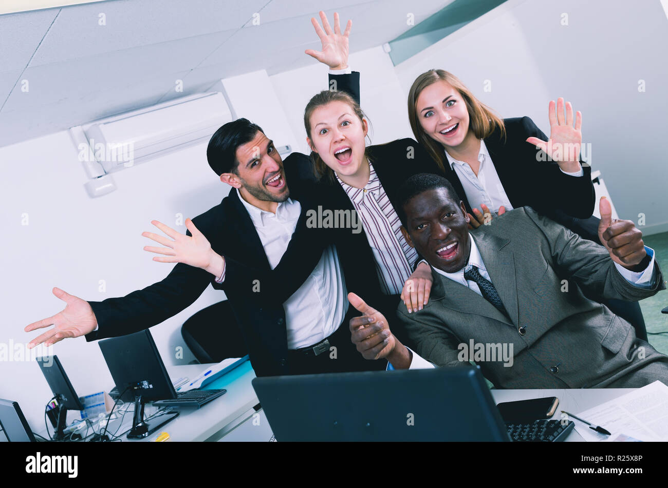 friendly group of managers are happy and having fun in the office Stock ...