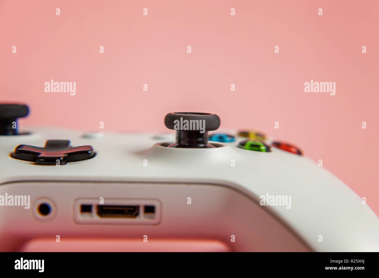 White joystick gamepad, game console on pink colourful trendy modern ...