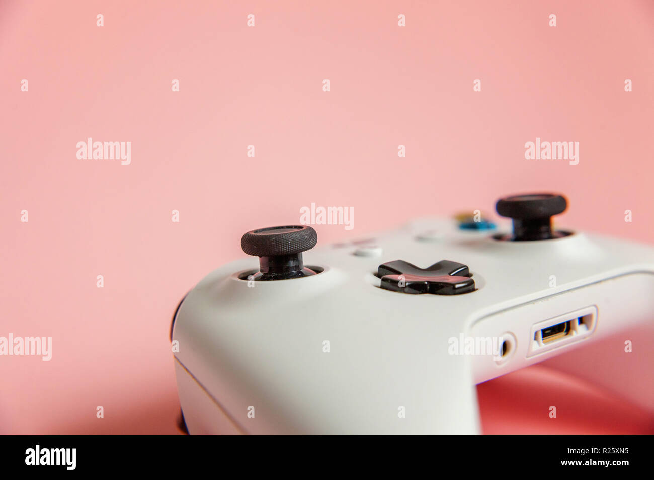 White joystick gamepad, game console on pink colourful trendy modern ...