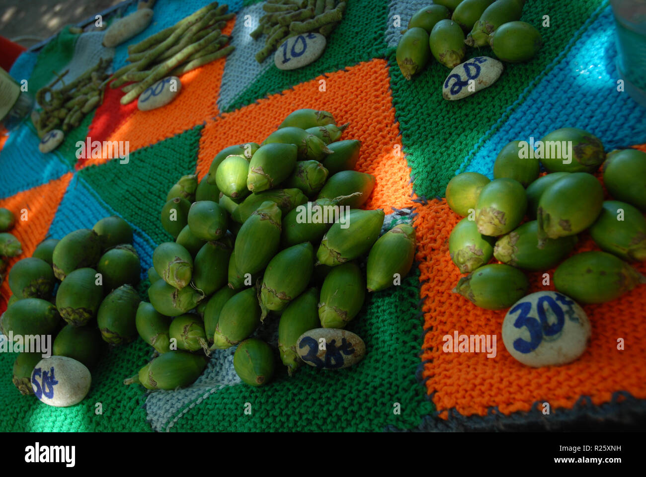 Piles of betel nut, mustard and lime powder at market in Madang, Papua ...