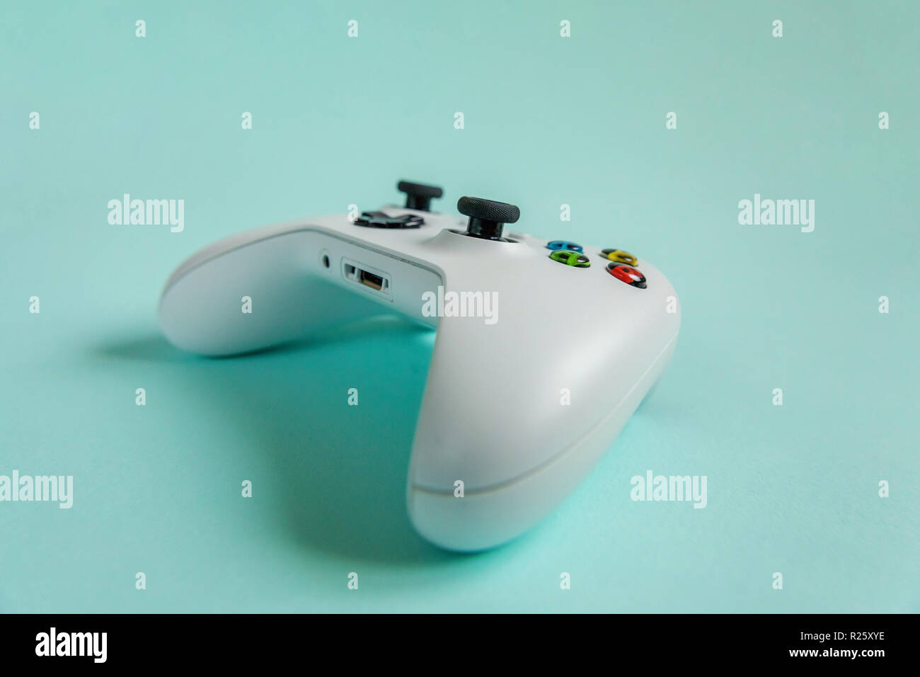 White joystick gamepad, game console on blue colourful trendy modern ...
