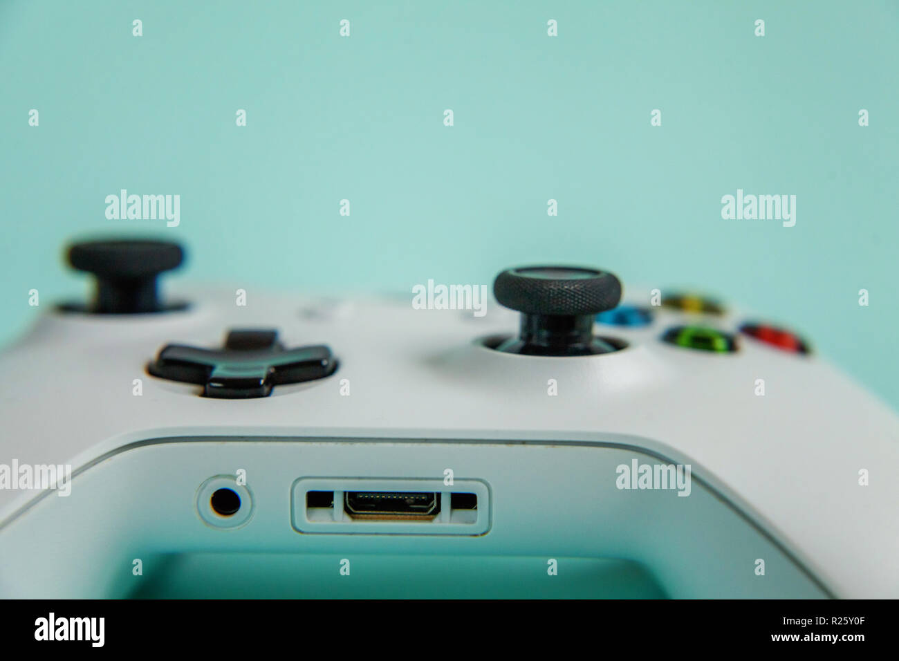 White joystick gamepad, game console on blue colourful trendy modern ...