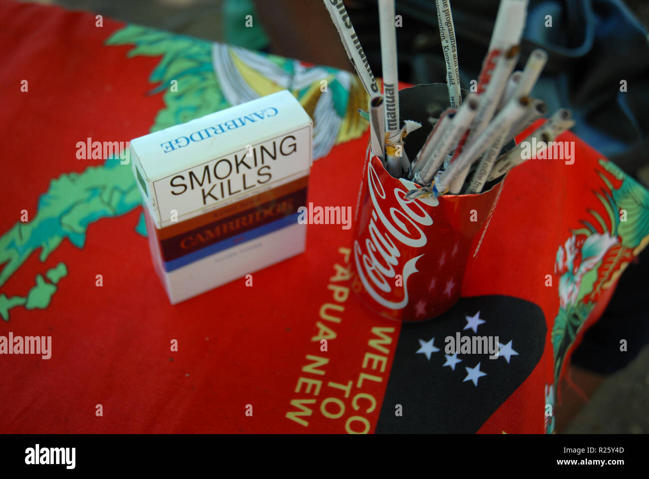 Woman selling handmade cigarettes at market in Madang, Papua New Guinea ...