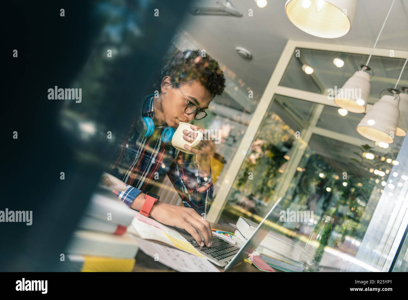 Nice serious man pressing a button on the laptop Stock Photo - Alamy