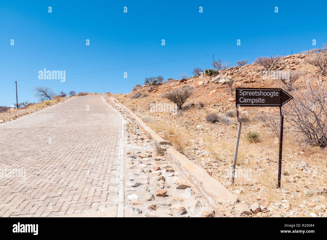 Spreetshoogt campsite sign, road gutter, stones and concrete, road ...