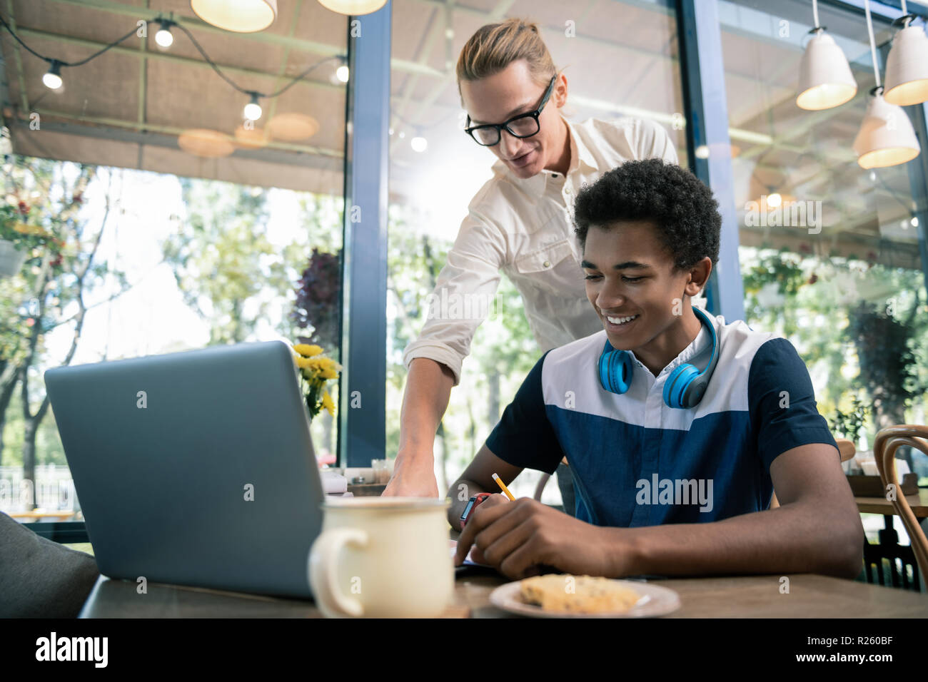Nice smart boy doing his school task Stock Photo - Alamy