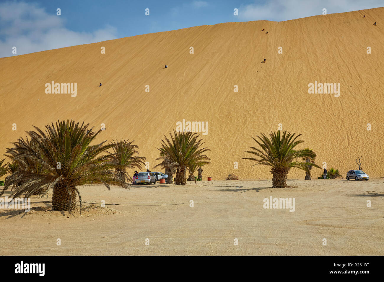 People climbing Dune 7 in Walvis Bay in Namibia, Africa Stock Photo - Alamy