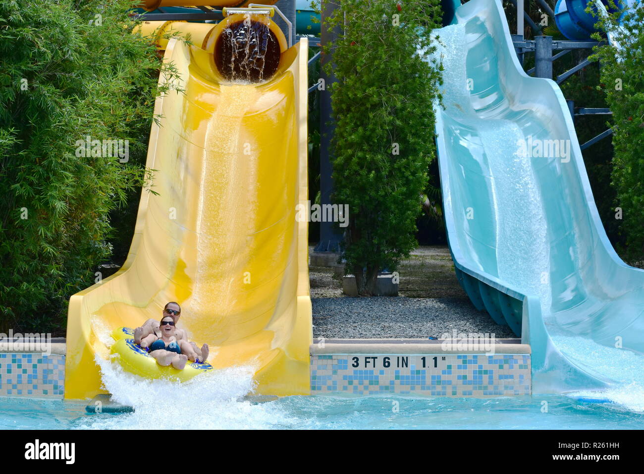Orlando, Florida. October 26, 2018 Funny couple enjoying slide water ...