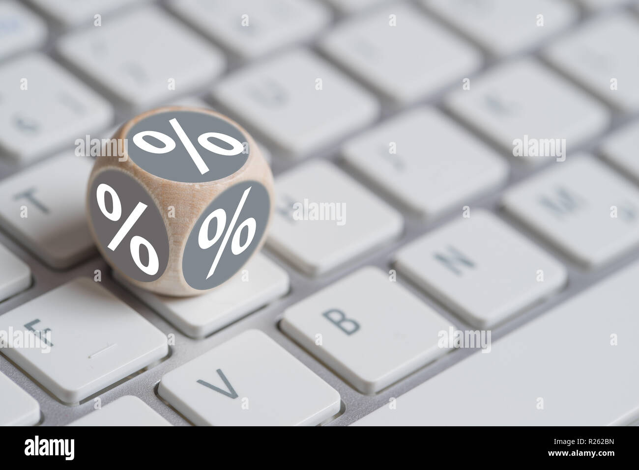 cube with percent symbol and a computer keyboard Stock Photo - Alamy