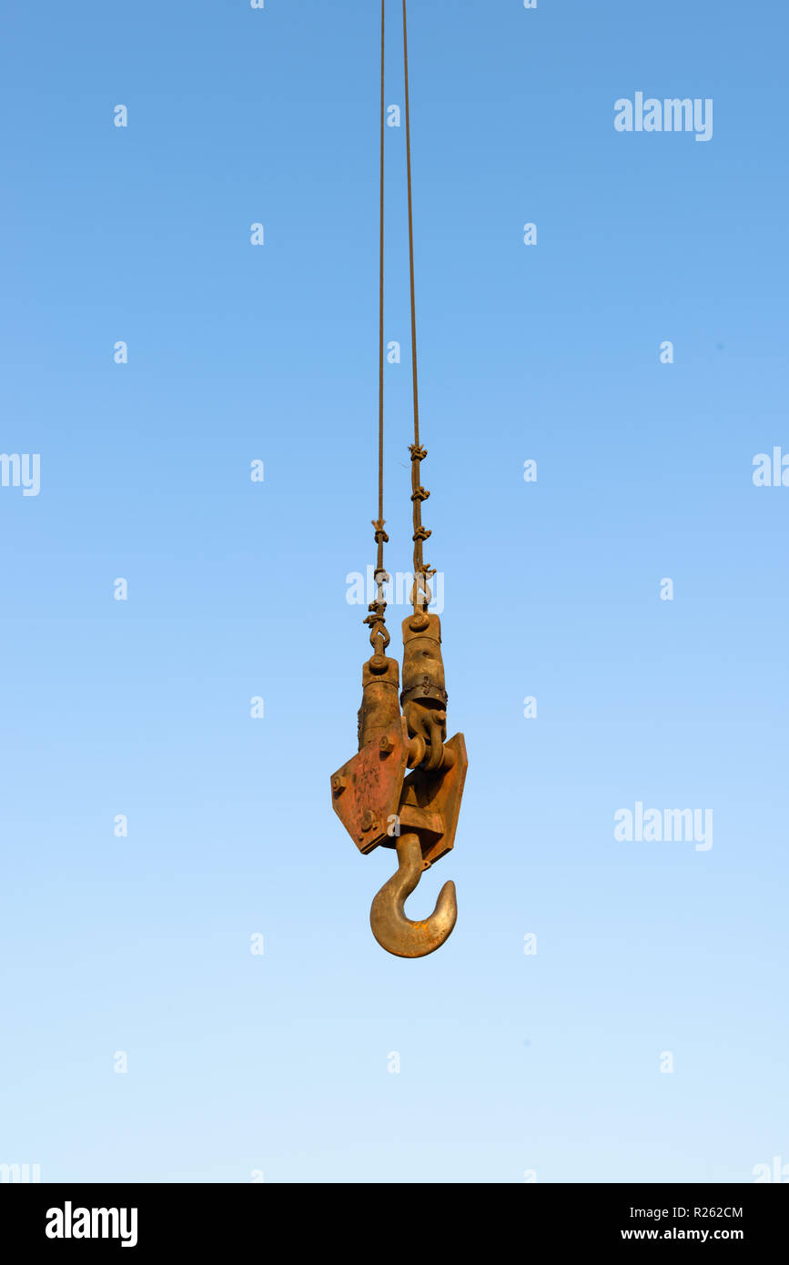 Tower crane with steel hook building metal construction Stock Photo - Alamy