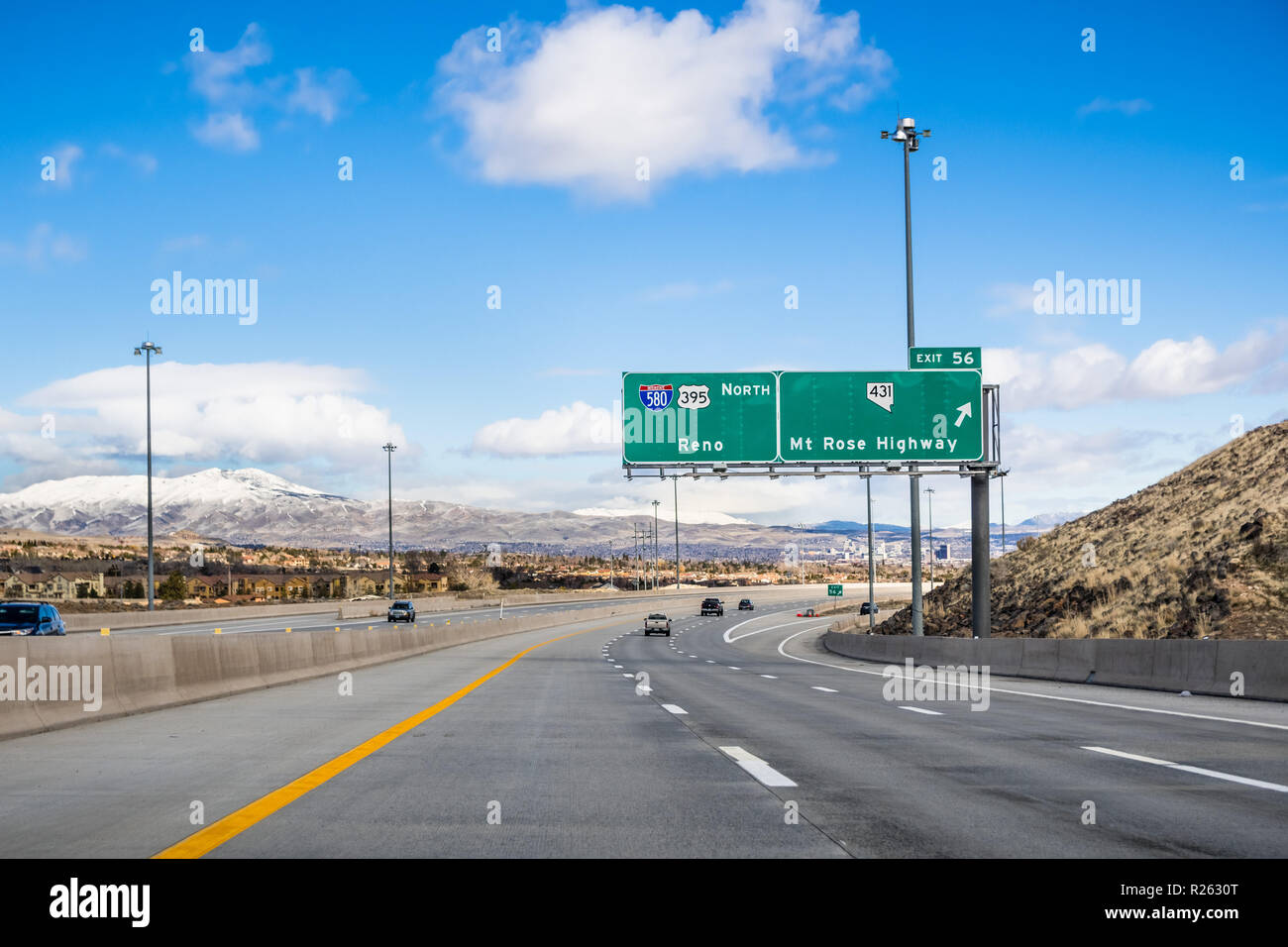 Travelling on the interstate towards Reno; the city's downtown visible ...