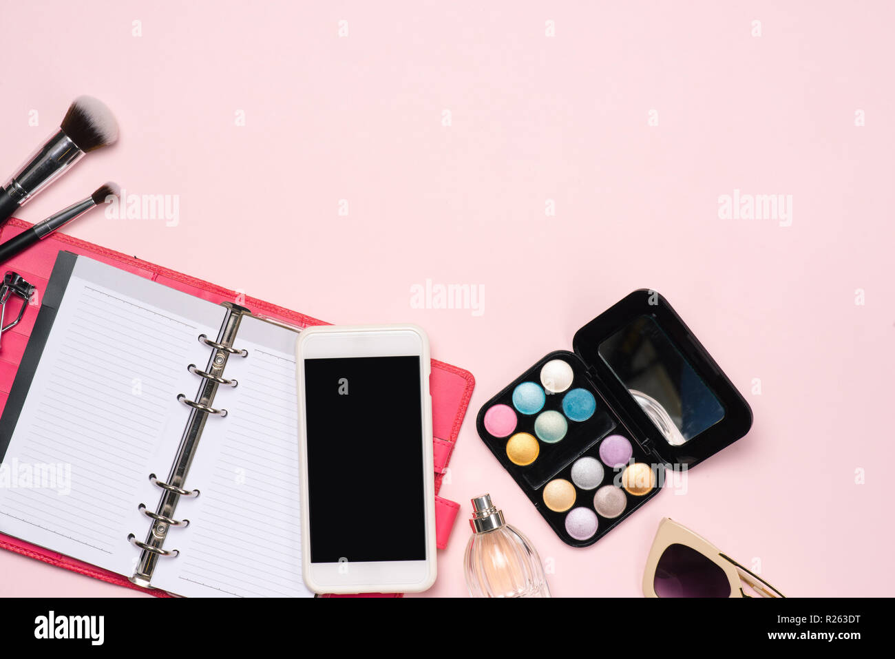 Composition with computer keyboard, cosmetics and flowers on color ...