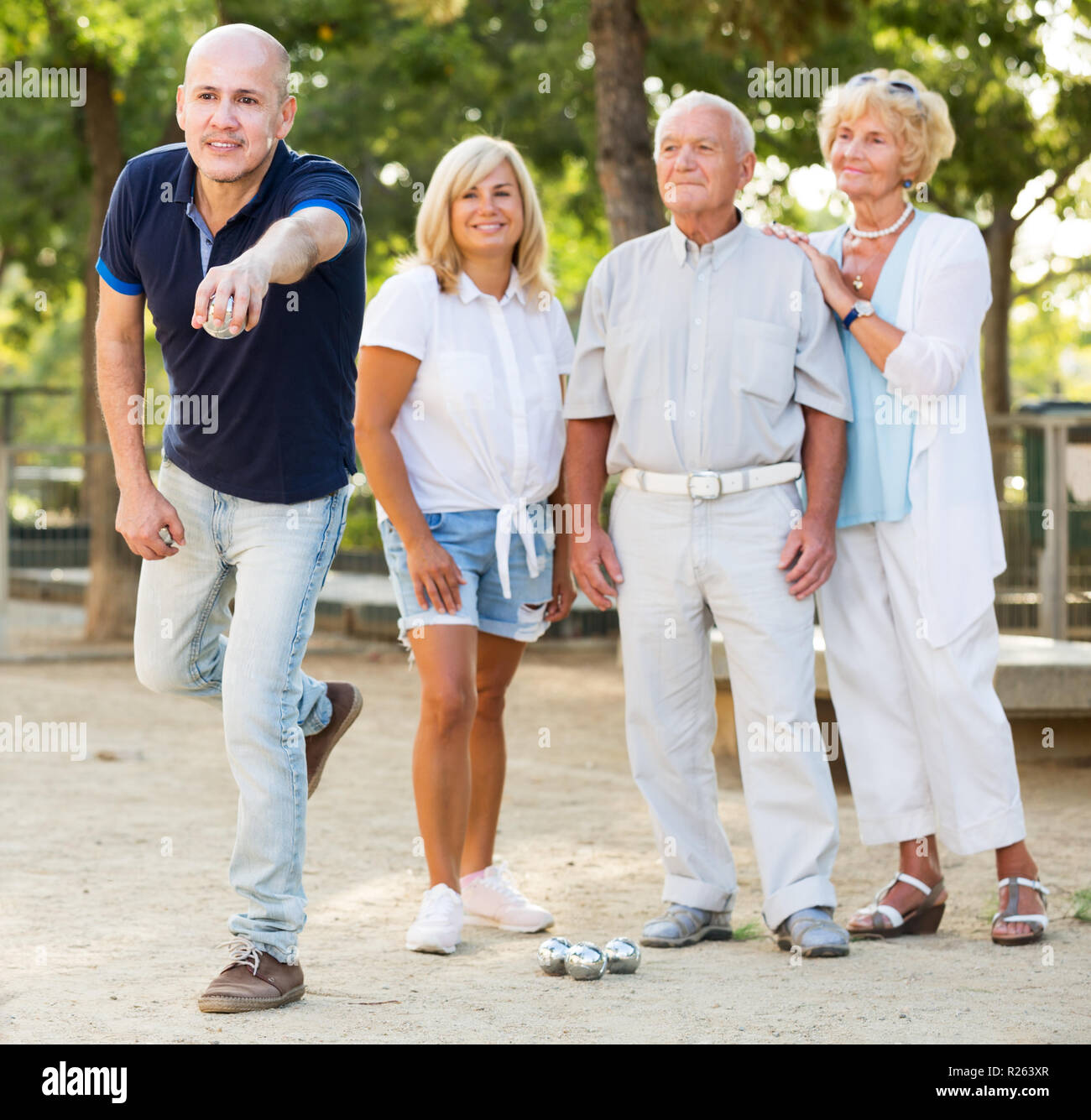 Happy senior people playing bocce in the park Stock Photo - Alamy