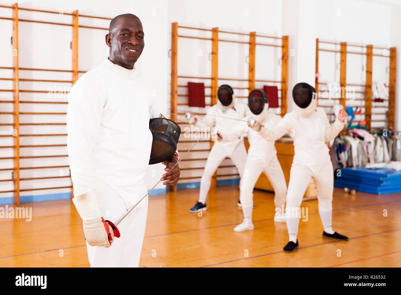 Sporty african american man fencer practicing effective fencing ...