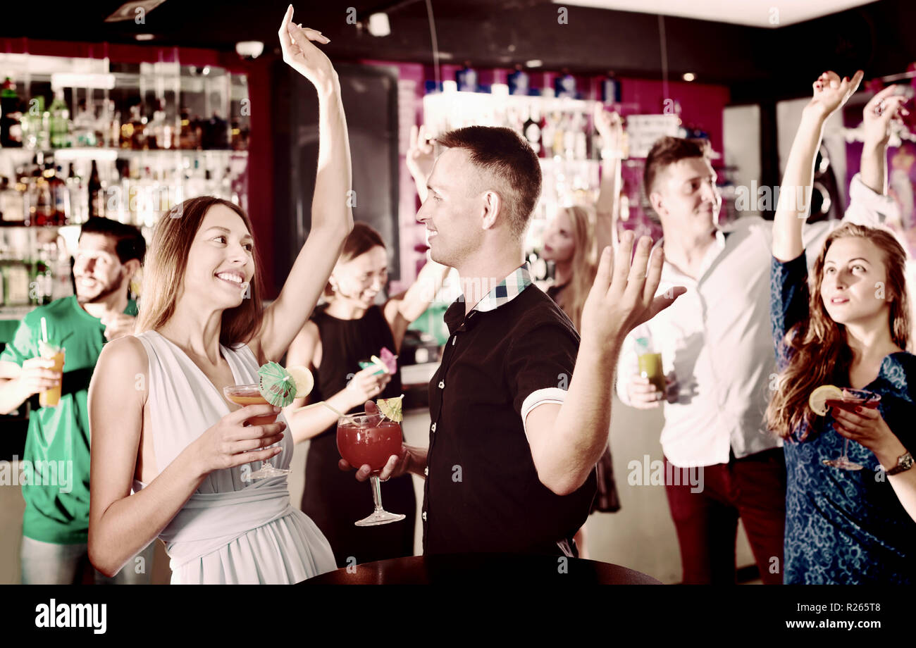 Young students dancing on party with cocktails at club Stock Photo - Alamy