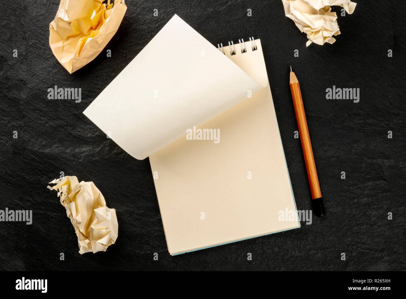 Idea Crisis. A simple spiral notepad with a blank sheet of paper and ...