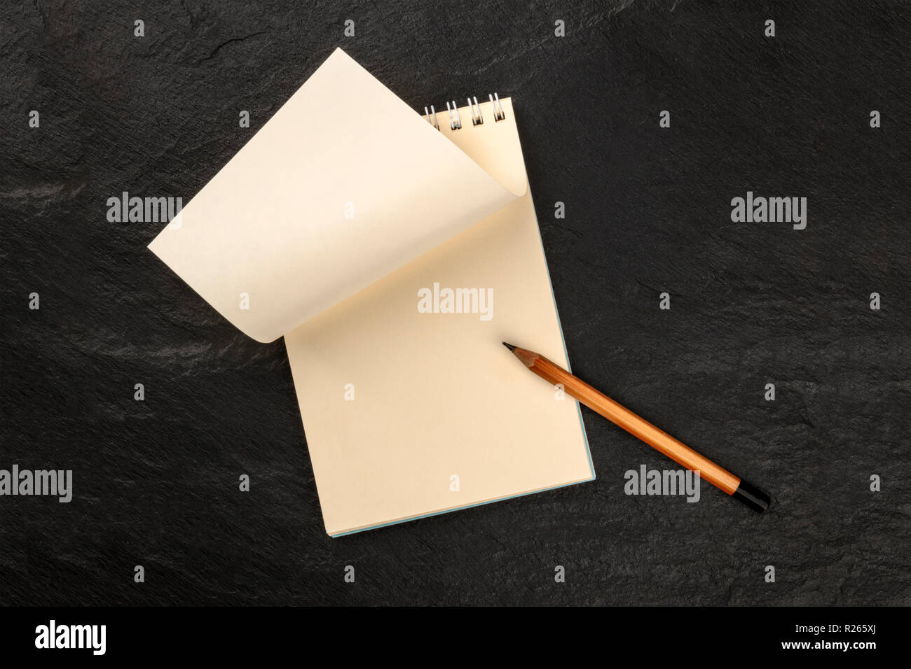 A New Page Turn. A photo of a simple spiral notepad with a blank sheet ...