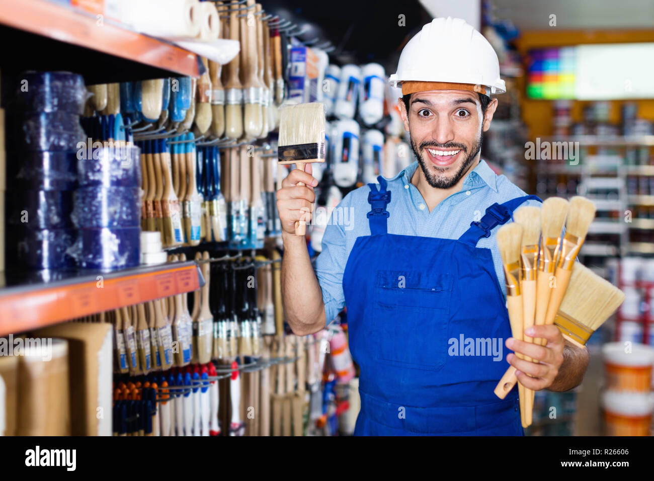 Handyman in blue uniform works hi-res stock photography and images - Alamy