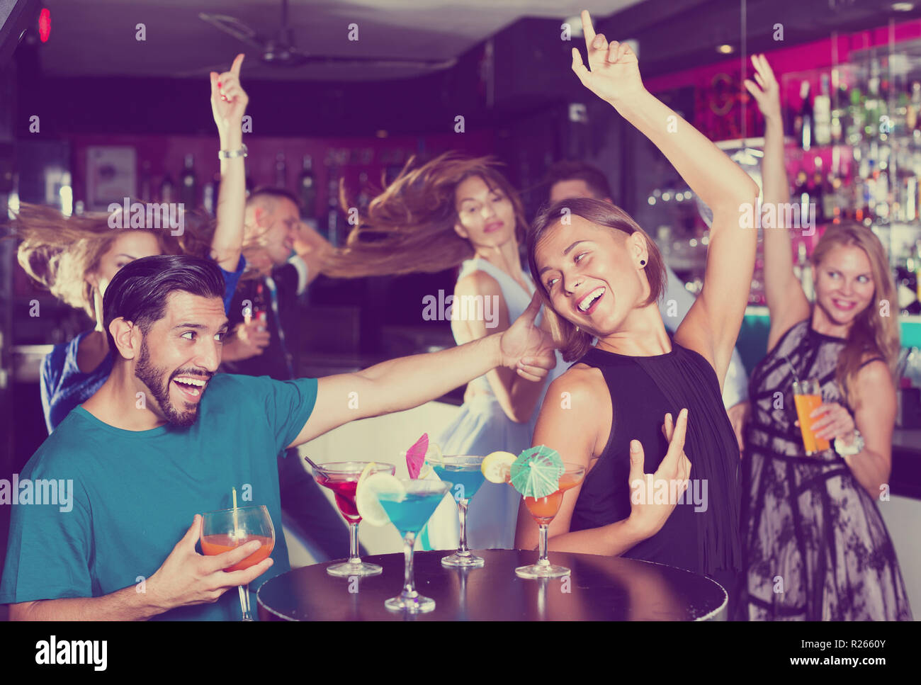 Woman in cocktail dress on bar hi-res stock photography and images - Alamy