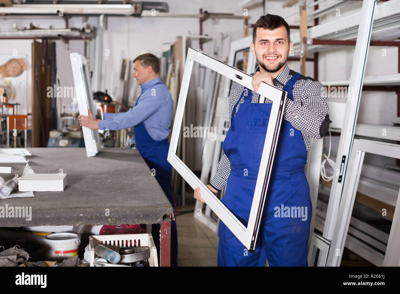 Engineer is demonstrating PVC manufacturing output in workshop Stock ...