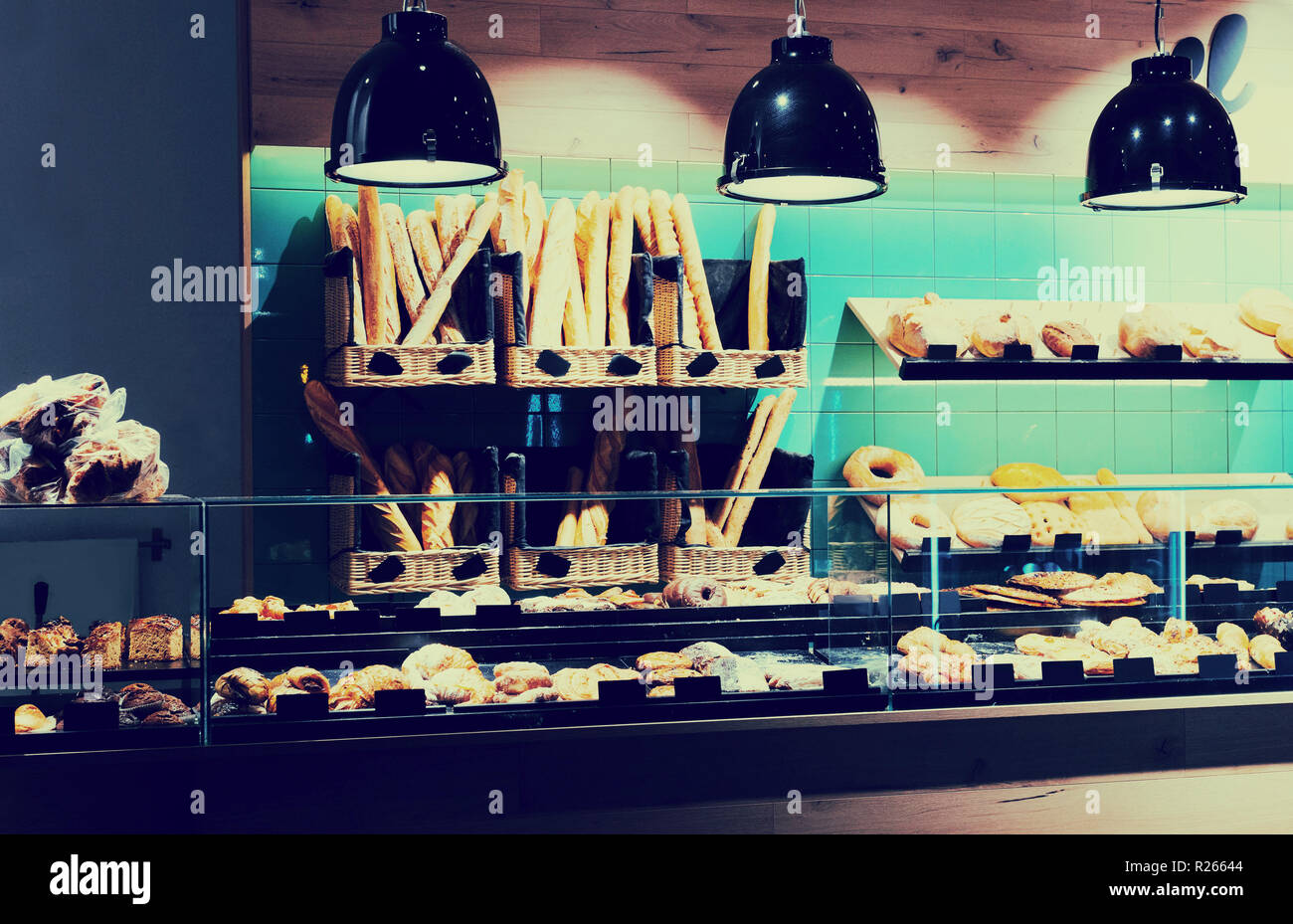 view on bakery counter with many different pastries and bread displayed ...