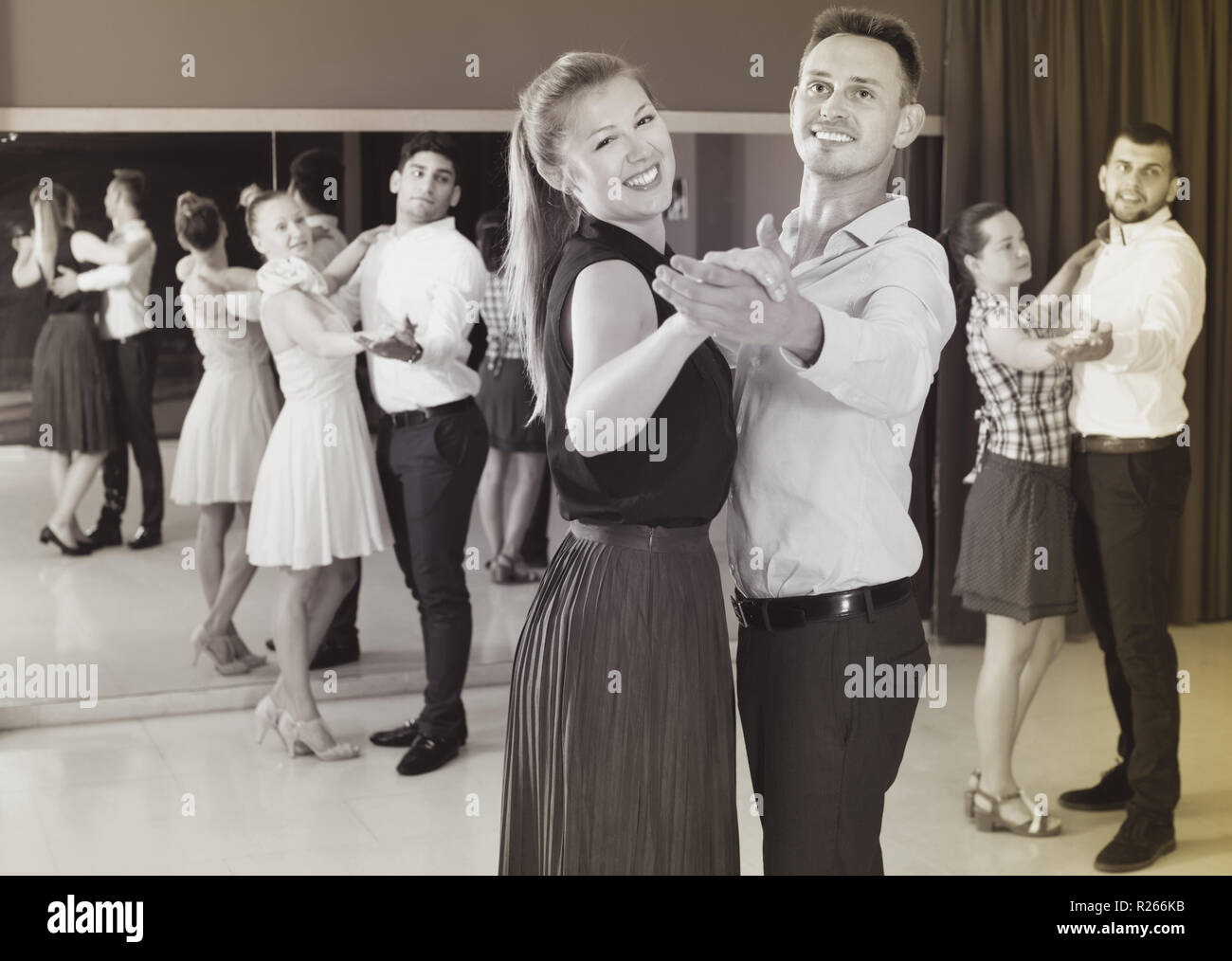 Cheerful young people learning dance hi-res stock photography and ...