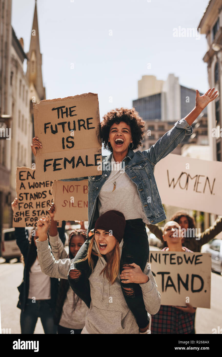 People marching with banner hi-res stock photography and images - Alamy