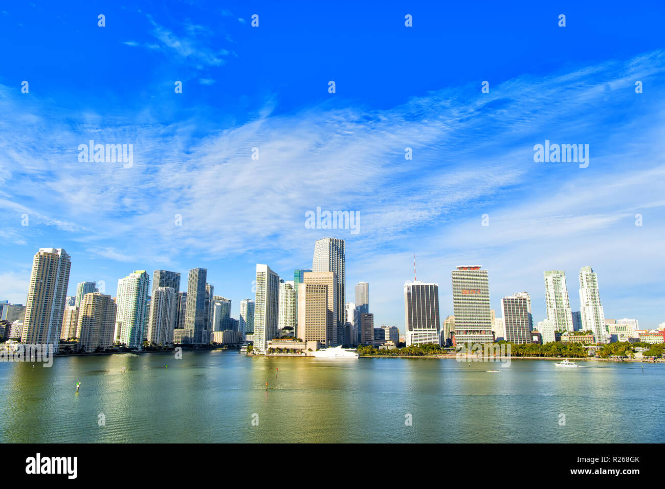 Aerial view of Miami skyscrapers with blue cloudy sky,white boat ...
