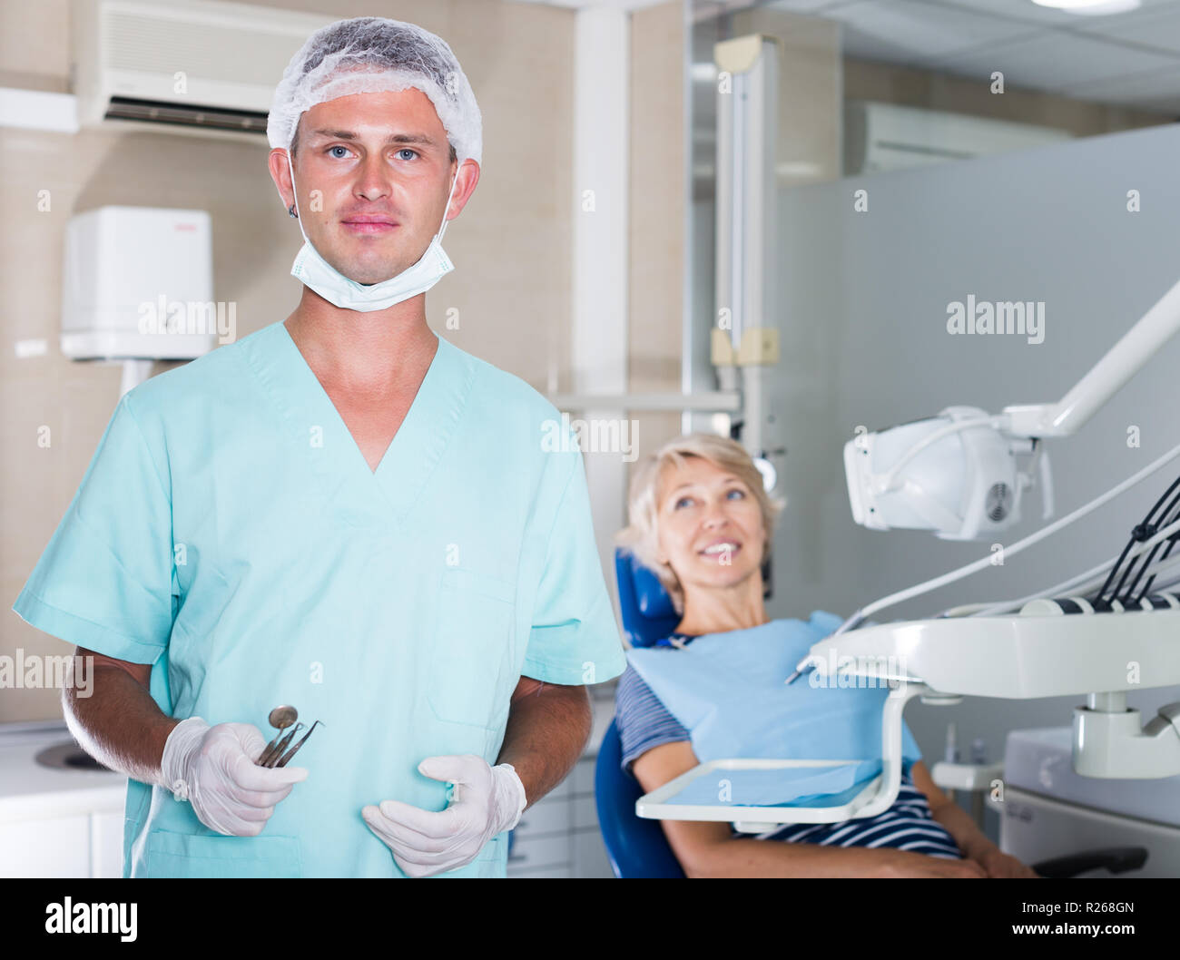 Male dentist with female patient in modern dentistry Stock Photo - Alamy