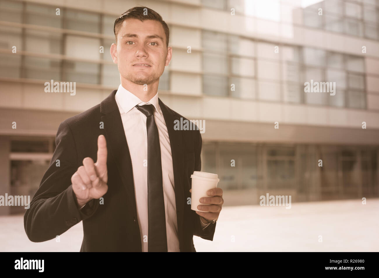 Successful businessman is asking companion to wait because he has a ...