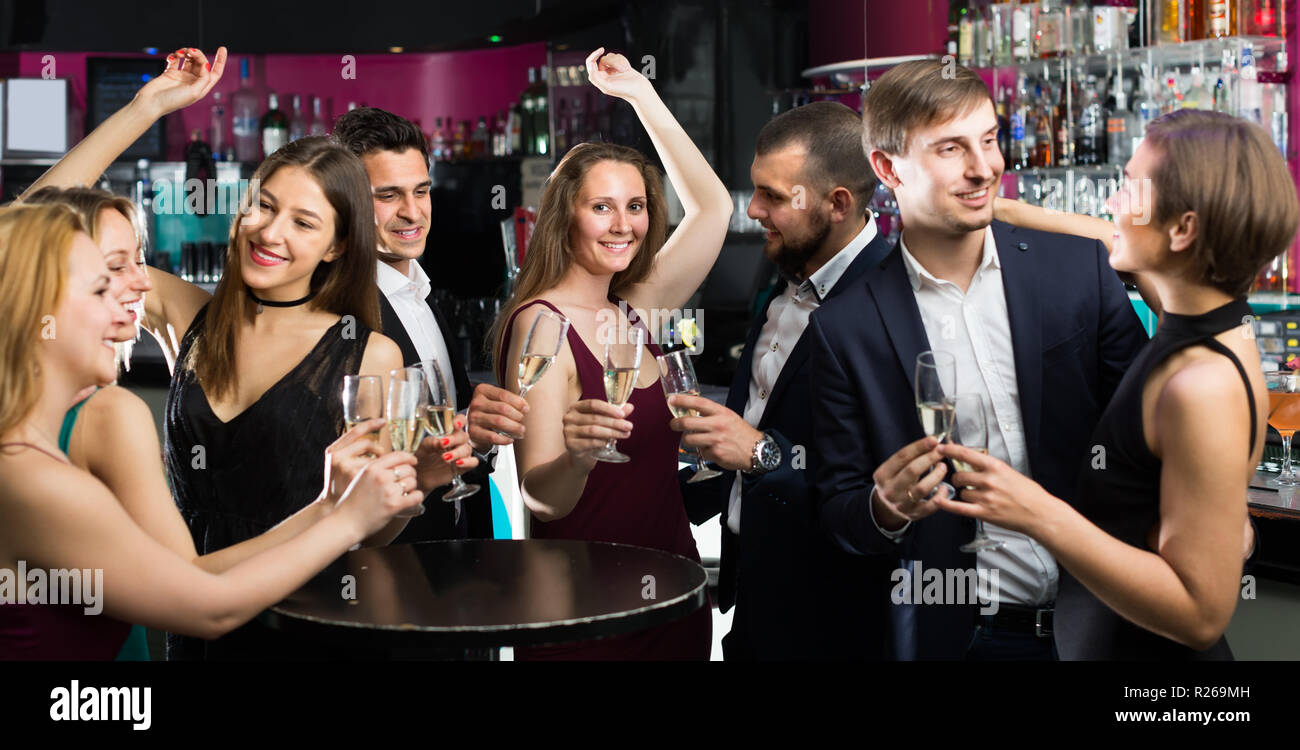 Portrait of young office workers with champagne in the night club Stock ...