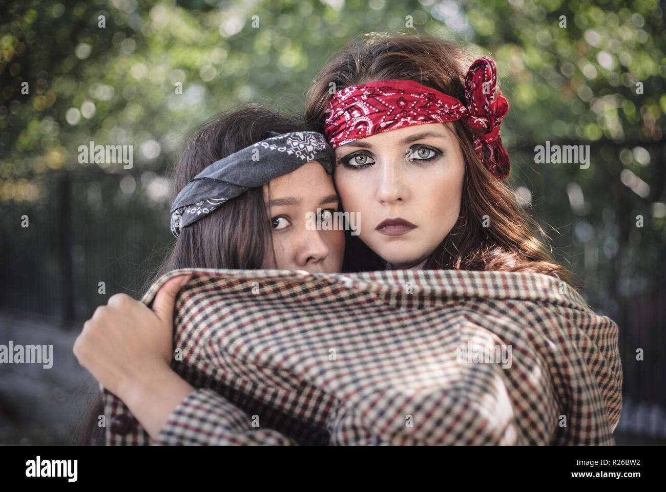 Portrait of two girls outdoors. The concept of difficult teenagers, bad ...
