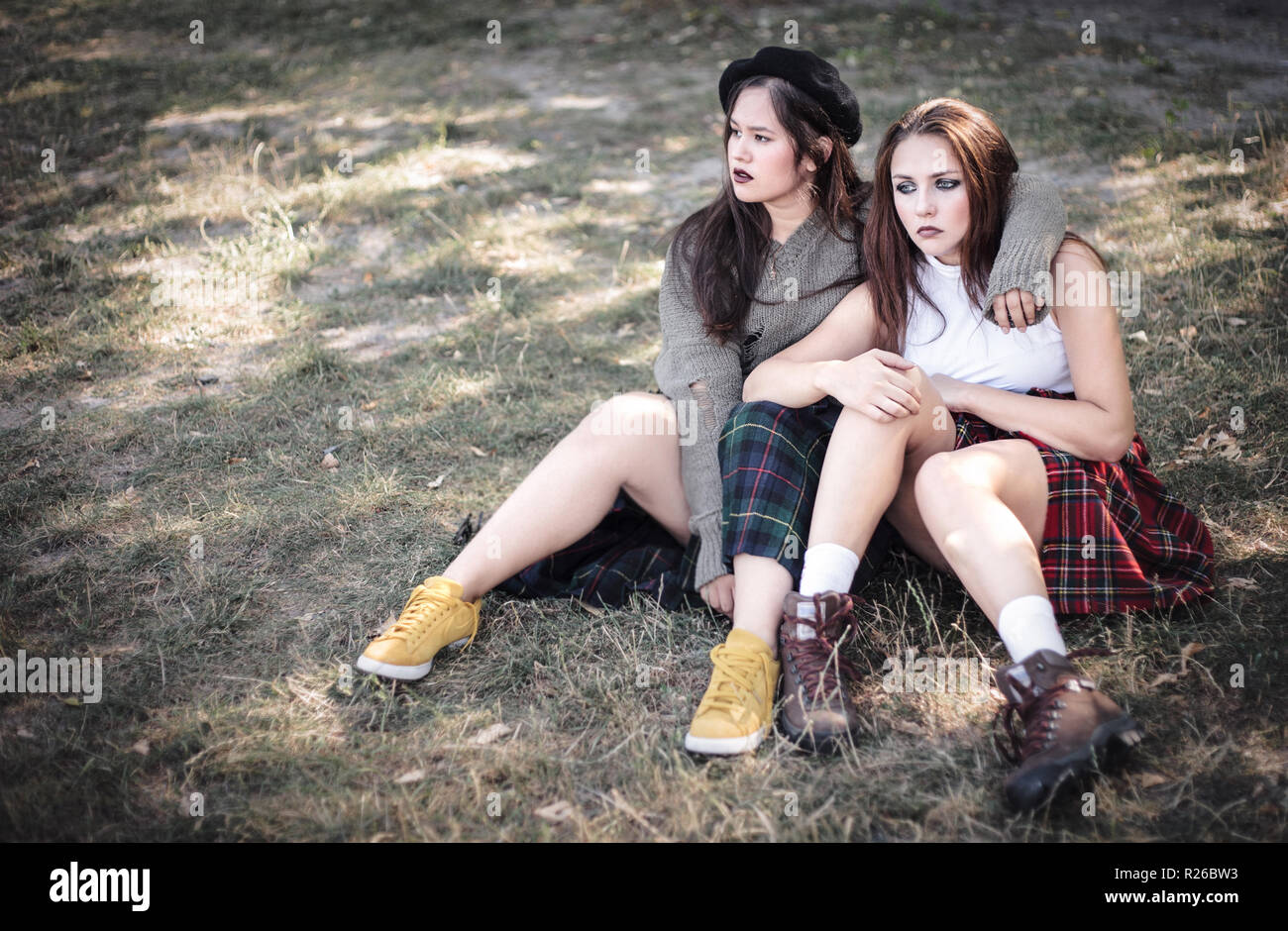 Two girls spend time together outdoors. The concept of difficult ...