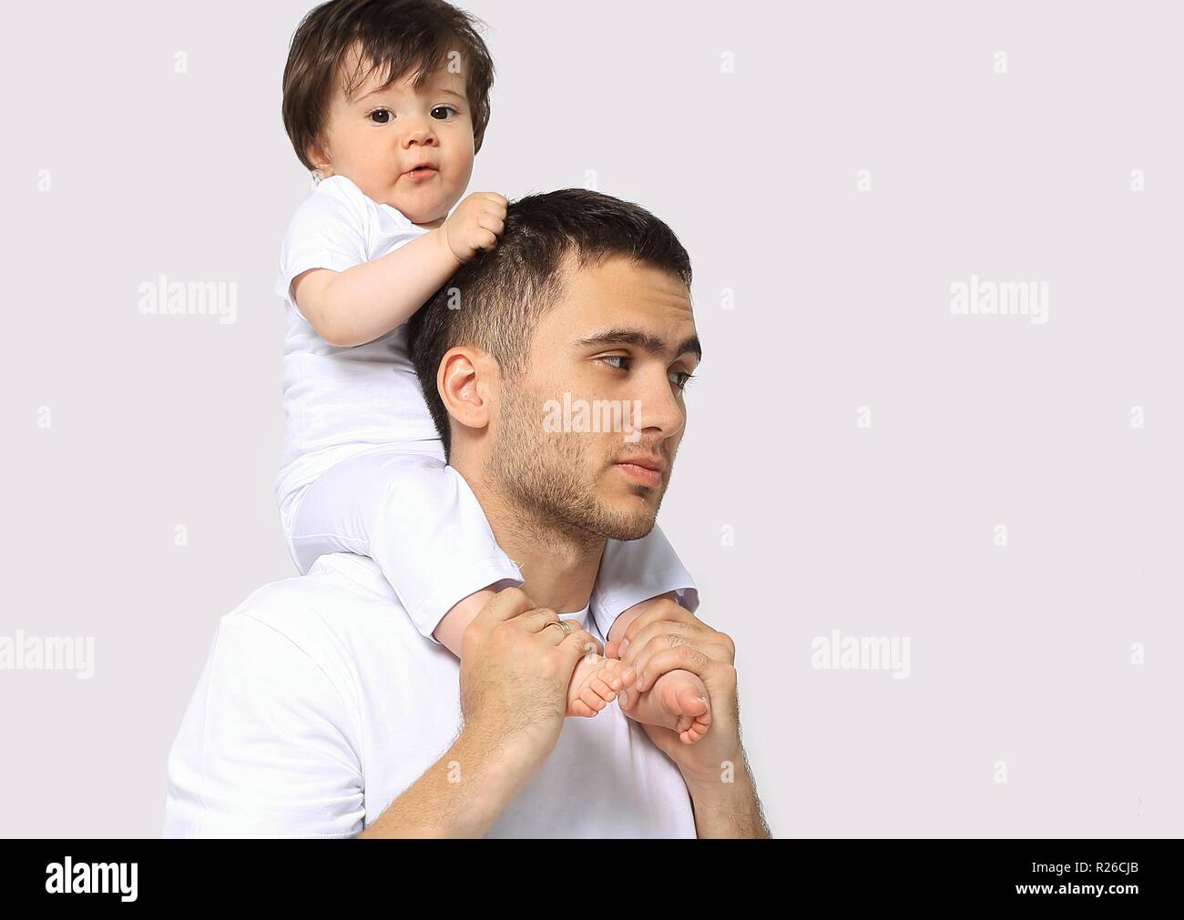 Happy family with newborn baby on a white background Stock Photo - Alamy