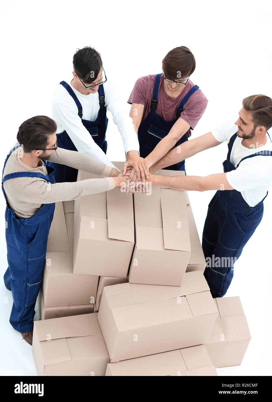 Delivery men carrying stack of boxes. Isolated on white Stock Photo - Alamy