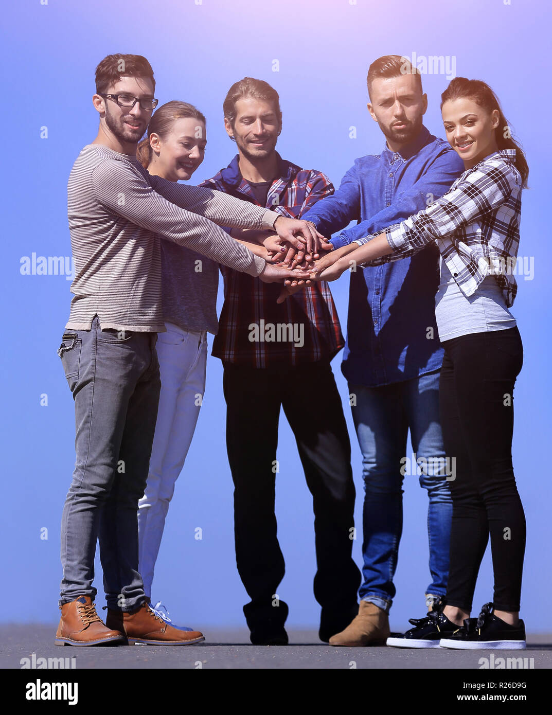 group of young people clasped their hands together Stock Photo - Alamy