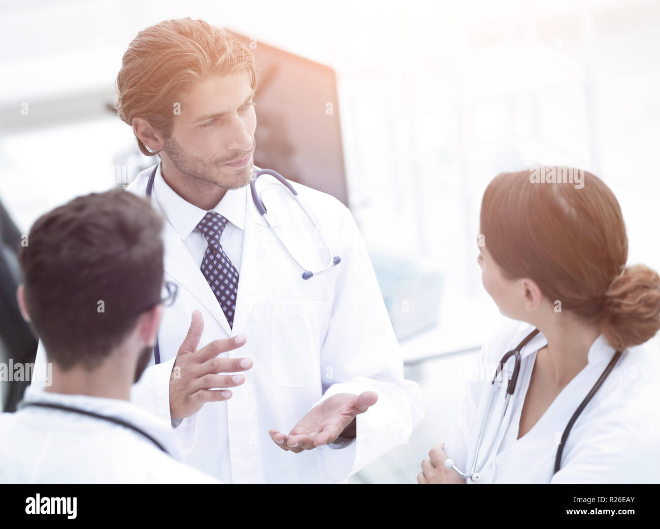 Group of doctors talking Stock Photo - Alamy