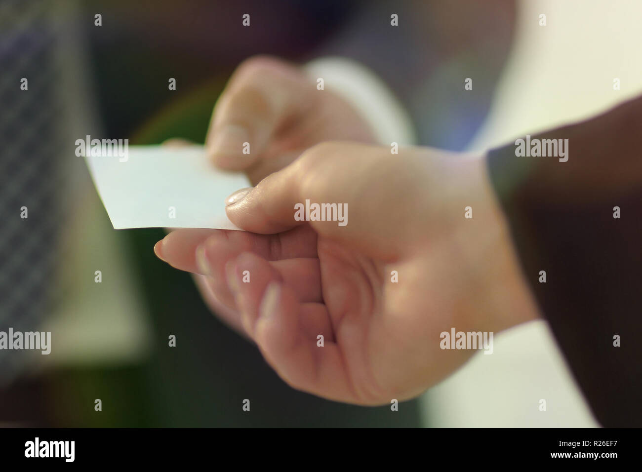 Exchange business card for first time meet Stock Photo - Alamy
