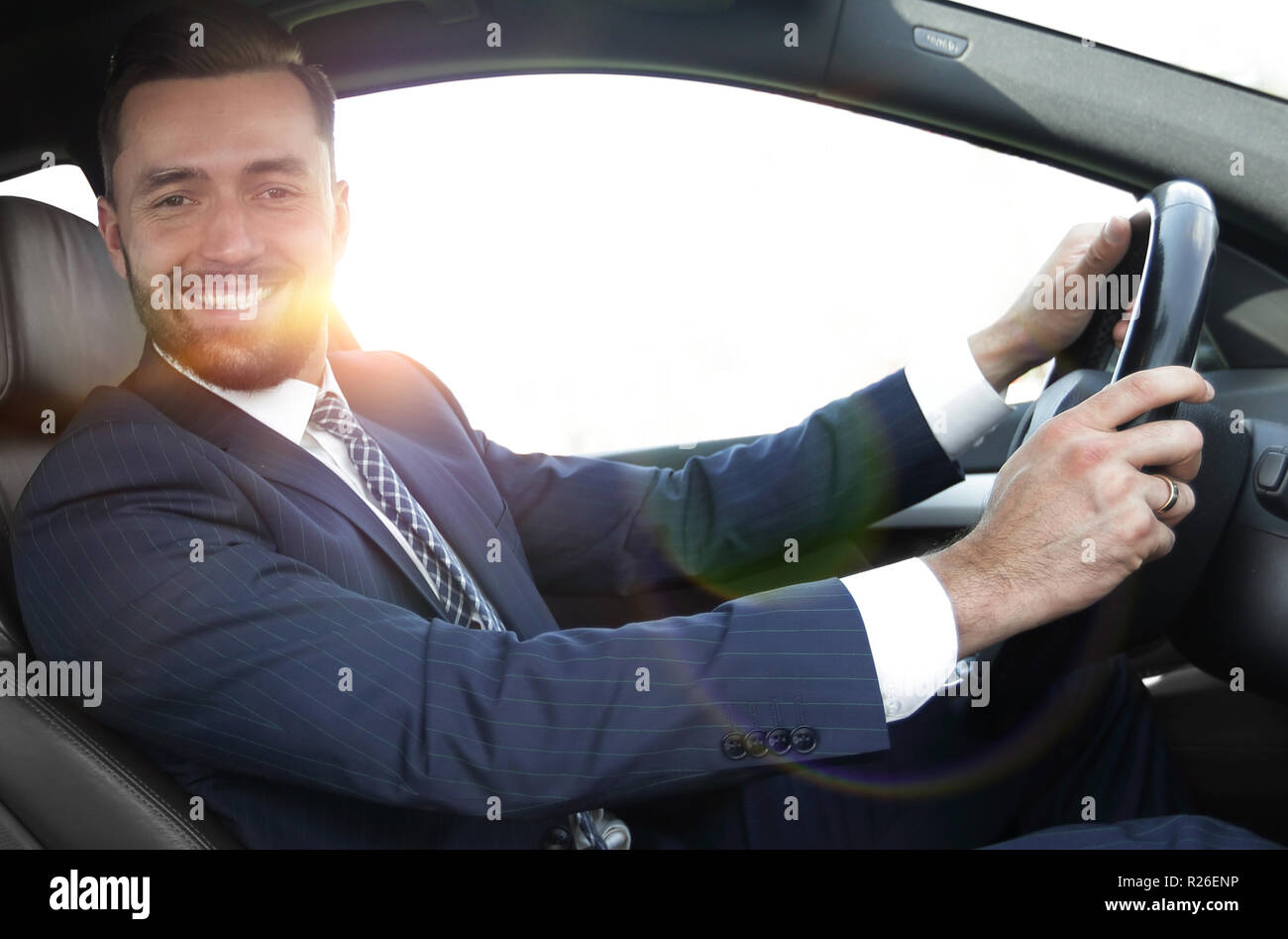 portrait of confident businessman driving a car Stock Photo - Alamy
