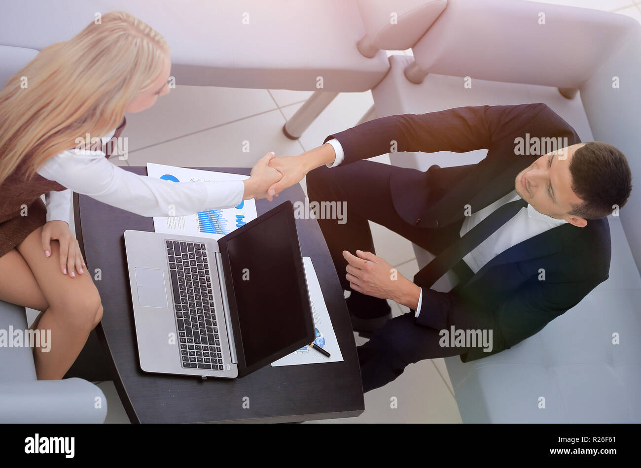 handshake Manager and the client Stock Photo - Alamy