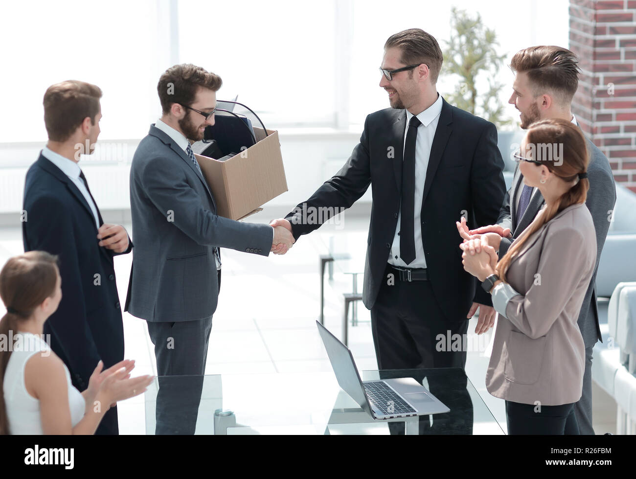 handshake Manager with a new employee in the office Stock Photo - Alamy