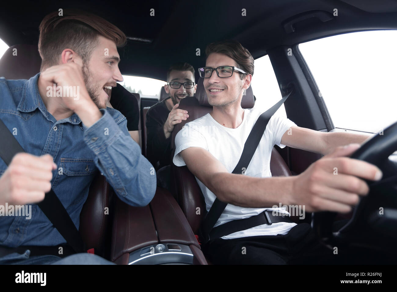 close up.happy friends talking in the car Stock Photo - Alamy