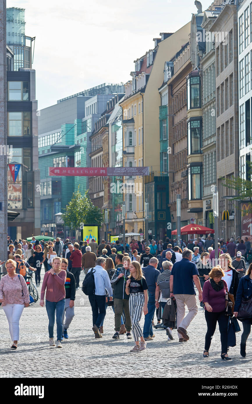 Tourists and residents in a popular shopping street in the center of ...